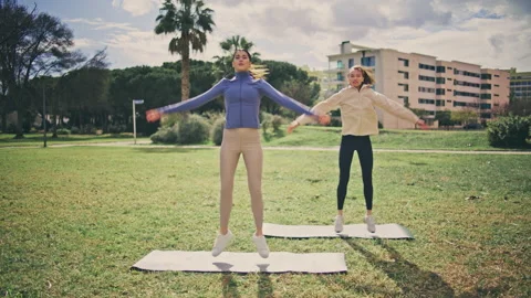 Active ladies jumping jack exercising su... | Stock Video | Pond5