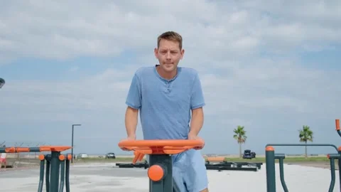 Active man exercising at outdoor gym. Yo... | Stock Video | Pond5