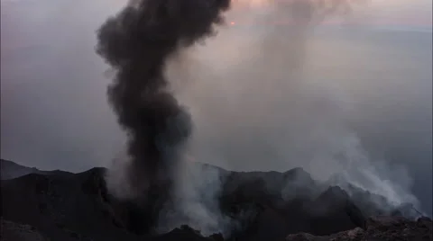 Active volcano erupting with black smoke... | Stock Video | Pond5