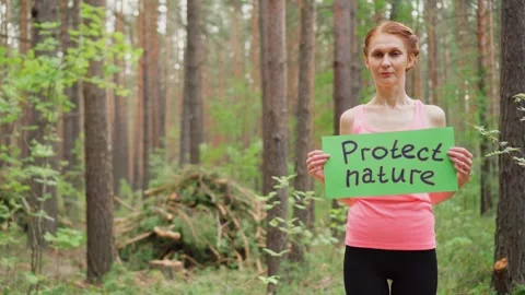 An activist with a poster "Protect natur... | Stock Video | Pond5