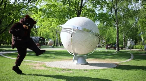 Actor dressed as bear jumps on one leg a... | Stock Video | Pond5