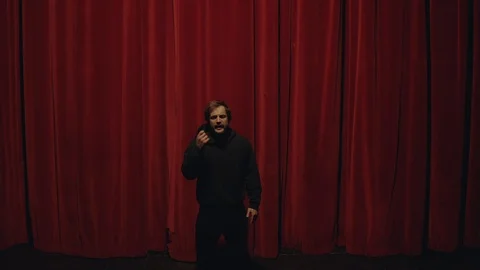 Actor in a theatre reviewing the script | Stock Video | Pond5