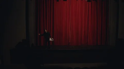 Actor in a theatre reviewing the script | Stock Video | Pond5