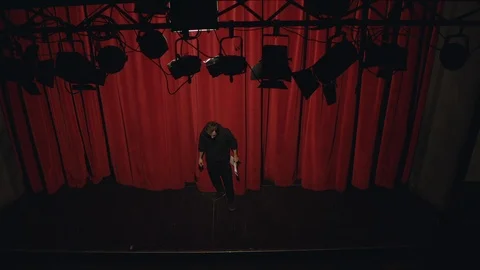 Actor in a theatre reviewing the script | Stock Video | Pond5