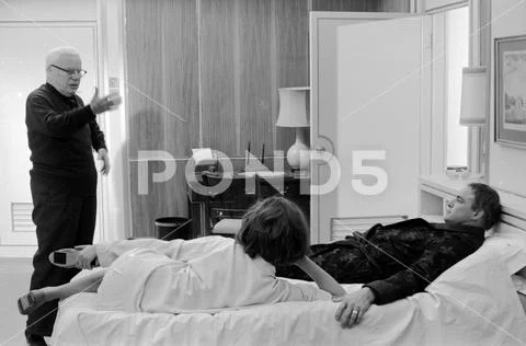 Photograph: Actors Marlon Brando and Sophia Loren lying on a bed while ...