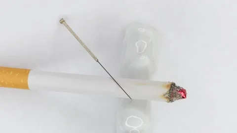 acupuncture needle and cigarette on a tu... | Stock Video | Pond5