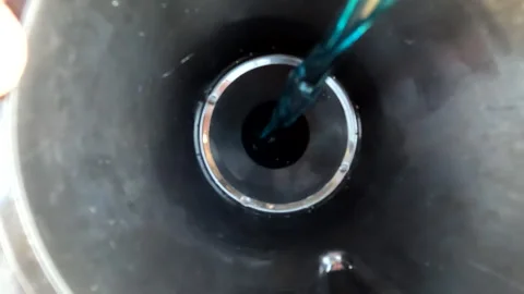 Adding antifreeze coolant to vehicle mul... | Stock Video | Pond5