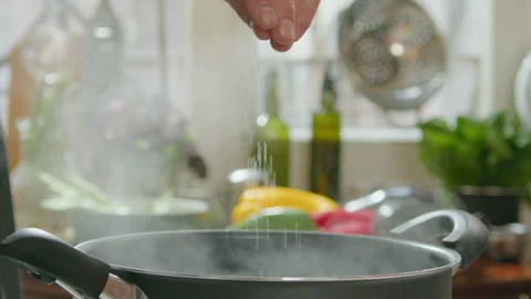 Adding Salt to Boiling Water in Cooking ... | Stock Video | Pond5