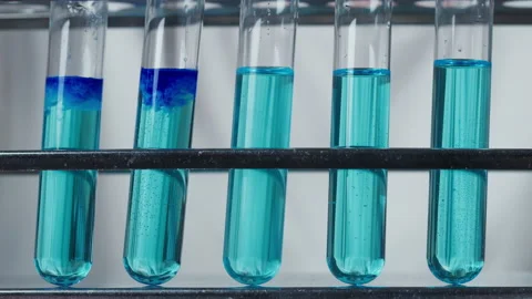 Adding solution into flasks with blue mi... | Stock Video | Pond5