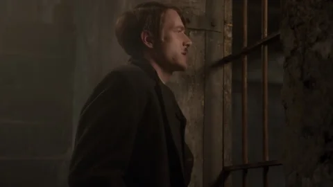 Adolf Hitler in prison looking out of pr... | Stock Video | Pond5