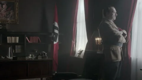 Adolf Hitler standing by window in offic... | Stock Video | Pond5