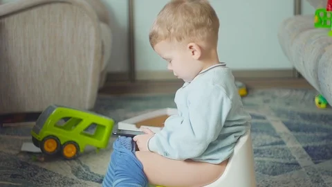 Adorable boy with a smartphone during po... | Stock Video | Pond5