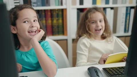 Adorable girls students using computer r... | Stock Video | Pond5