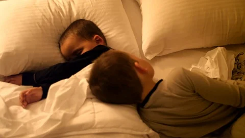 Adorable little brothers sleeping on top... | Stock Video | Pond5