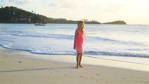 Adorable little girl at beach during sum... | Stock Video | Pond5
