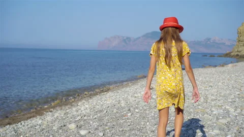 Adorable little girl at beach during sum... | Stock Video | Pond5