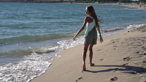 Adorable little girl at beach during sum... | Stock Video | Pond5