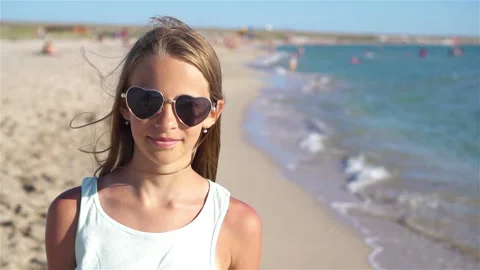 Adorable little girl at beach during sum... | Stock Video | Pond5