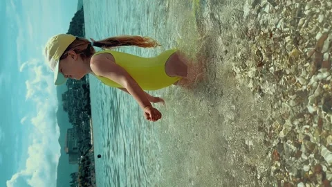Adorable little girl at beach during sum... | Stock Video | Pond5