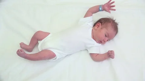Adorable newborn moving hands and legs, ... | Stock Video | Pond5