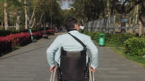 Adult disability man walking in the park... | Stock Video | Pond5