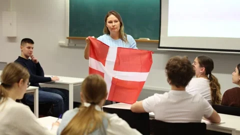 Adult female teacher showing the flag of... | Stock Video | Pond5