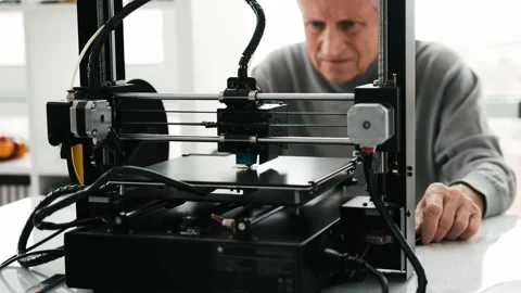 Adult man with 3D printer | Stock Video | Pond5
