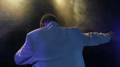 Adult man sings on stage. Back view, low... | Stock Video | Pond5