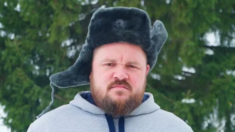 An adult Russian man with a beard looks ... | Stock Video | Pond5