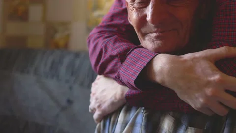adult son visits his father. a man hugs ... | Stock Video | Pond5