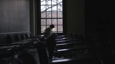 Adult Student Sitting in an Empty Dark C... | Stock Video | Pond5