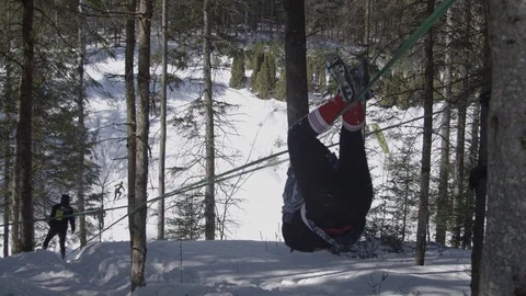 Adventure race winter slack line descent | Stock Video | Pond5