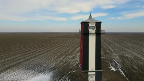 Aerial 4k flight - lighthouse on the fie... | Stock Video | Pond5