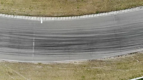 Aerial above view of race cars racing in... | Stock Video | Pond5