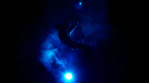 Aerial acrobat man on circus stage. Silh... | Stock Video | Pond5