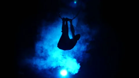 Aerial acrobat man on circus stage. Silh... | Stock Video | Pond5
