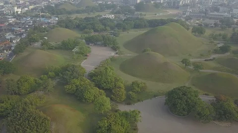 Aerial Backwards over Tumuli-gongwon par... | Stock Video | Pond5