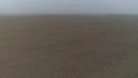 Aerial of bare field with no crops and b... | Stock Video | Pond5