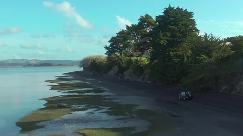 Aerial: Car driving on the beach in the ... | Stock Video | Pond5