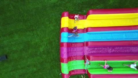 Aerial of children playing on a large in... | Stock Video | Pond5