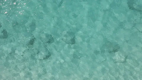 Aerial of a clean turquoise sea water te... | Stock Video | Pond5