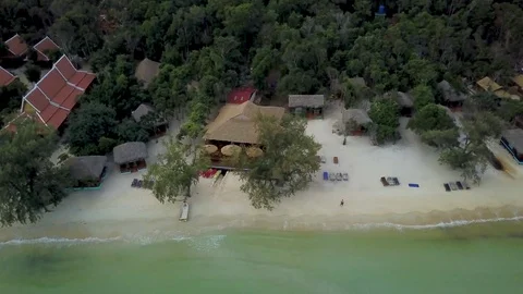 Aerial descending with water lapping up ... | Stock Video | Pond5