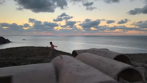 Aerial dolly out shot of a young man run... | Stock Video | Pond5