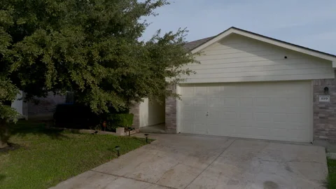 Aerial dolly, white suburban home and ga... | Stock Video | Pond5