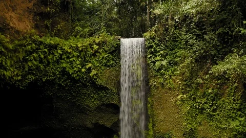 Aerial drone flight at cave with waterfa... | Stock Video | Pond5