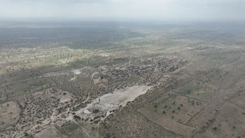 Aerial of empty land above rural Tharpar... | Stock Video | Pond5