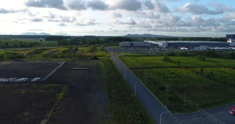 Aerial - field and building | Stock Video | Pond5