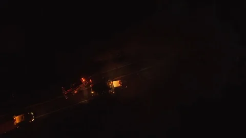 aerial fire fighters on car on fire bein... | Stock Video | Pond5