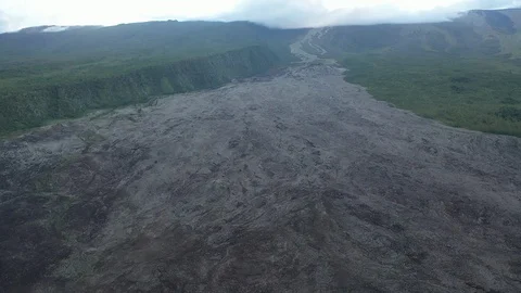 Aerial flight over the dried lava flow f... | Stock Video | Pond5