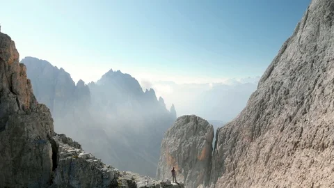 Aerial Flying Backwards Over Man Climber... | Stock Video | Pond5